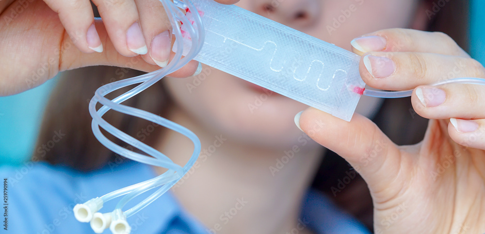Girl holding polymers Bio-MEMS biomedical microelectromechanical ...