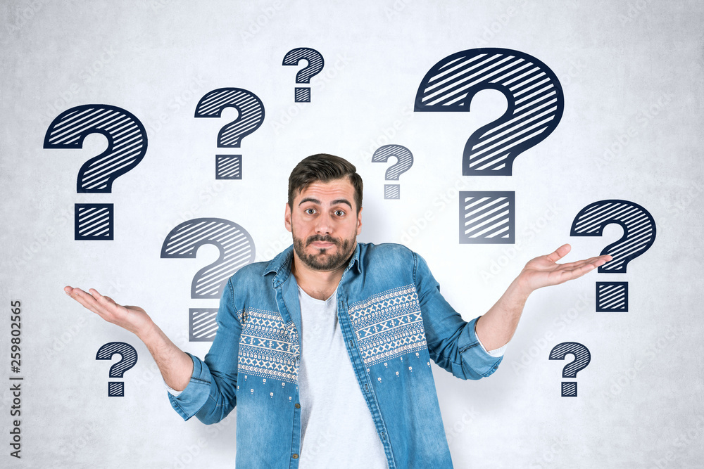 Confused man, question marks, concrete Stock Photo | Adobe Stock