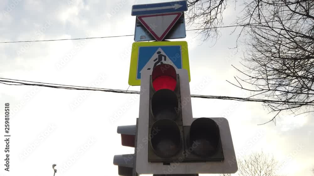 Traffic lights red, yellow, green, green arrow. Sign give way ...