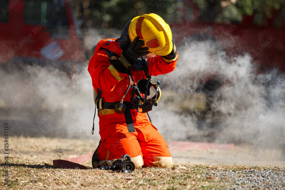 Fiefighter with fire fighting equipment and very light smoke Stock ...