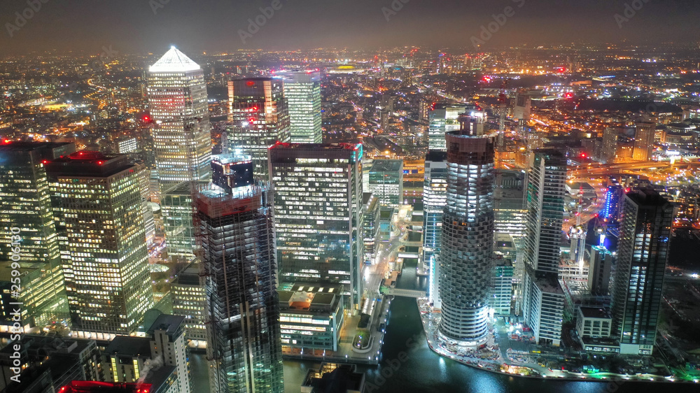 Aerial drone night shot from iconic Canary Wharf illuminated ...