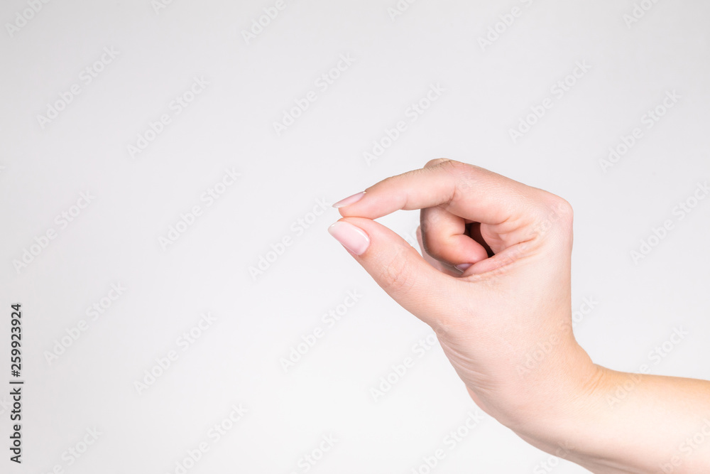 Closeup view of single female hand holding virtual card or invisible ...