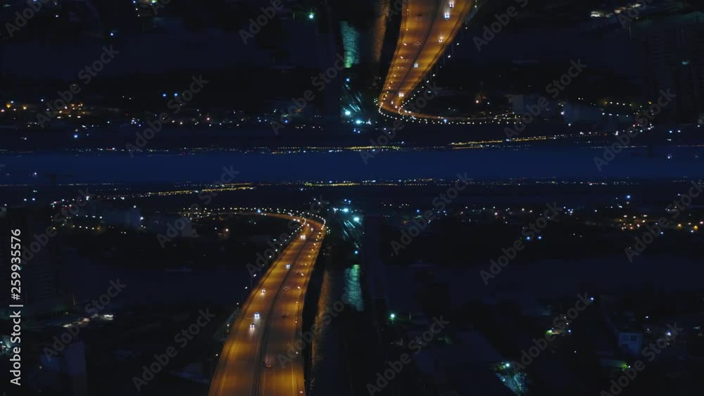 Moscow at night with urban architecture and river across the bridge ...