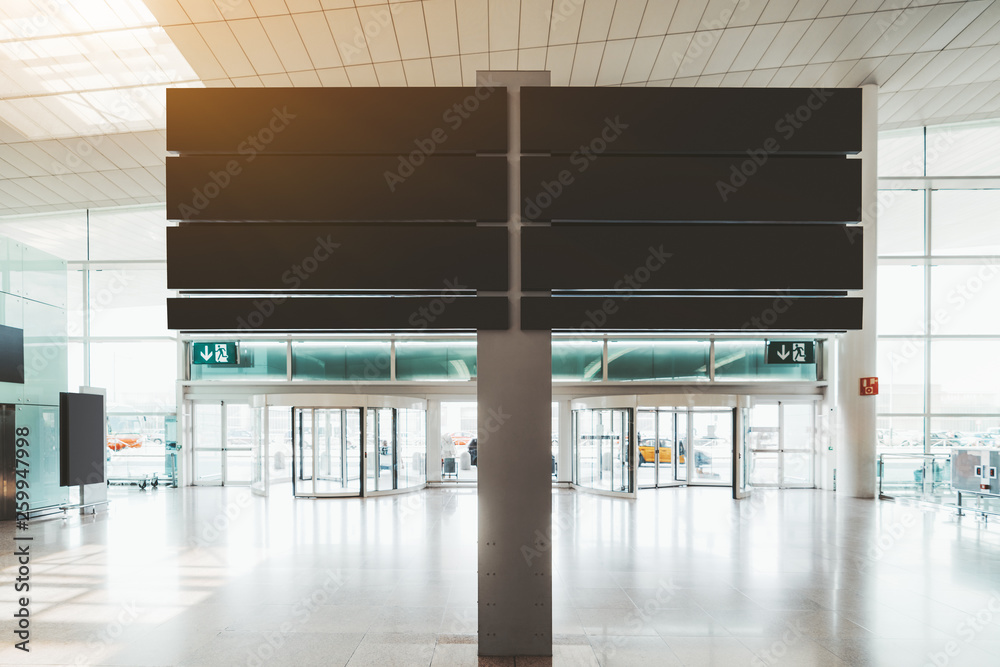 An empty black mockup of a route pointer in a modern airport terminal ...