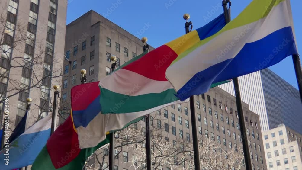 International flags from around the world. Pan of flags blowing in wind ...
