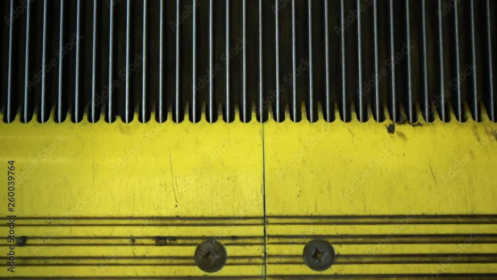 Escalator. Moving staircase in business center. Laziness. Moving steps ...