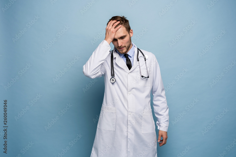 Doctor young man, medical professional terrified and nervous expressing ...