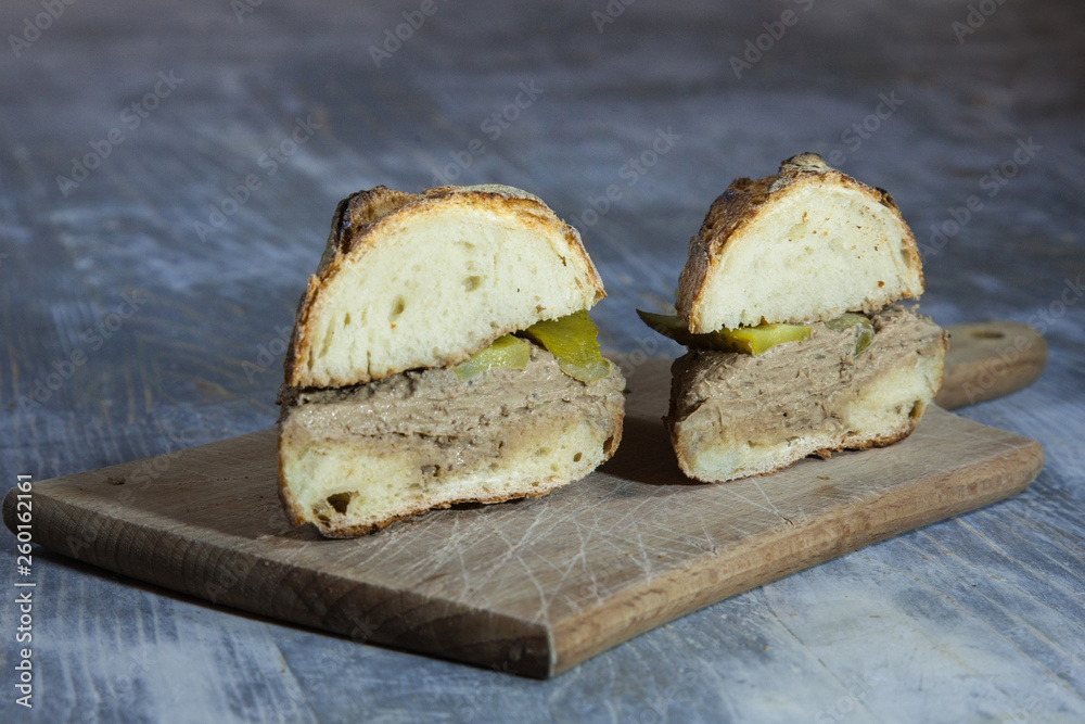 Liver Pate sandwich in a French baguette sliced in two, made of duck ...