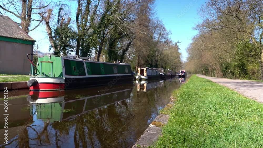 A canal boat, narrow boat heads upstream on the famous Llangollen canal ...