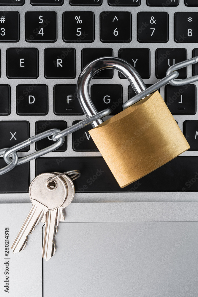 Padlock with chain and keys on a laptop computer keyboard. Cyber ...