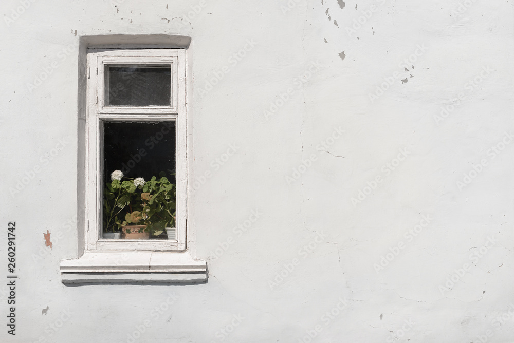 A small window in an old shabby white wall Stock Photo | Adobe Stock