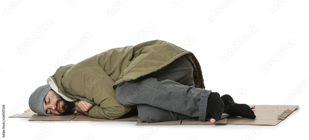Foto de Poor homeless man lying on cardboard, white background do Stock ...