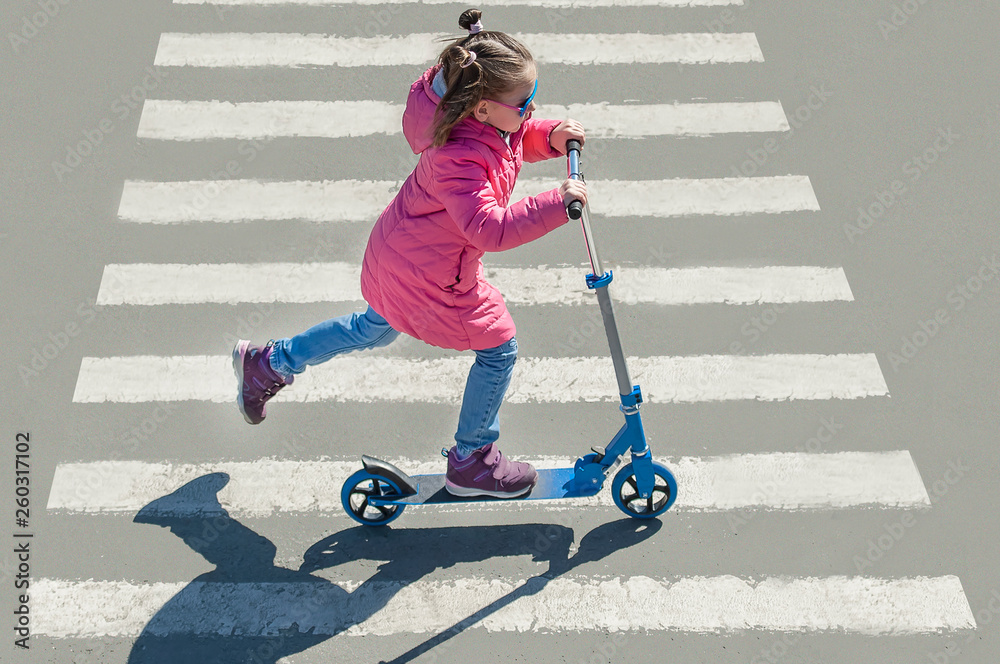 Child riding scooter. Kid on colorful kick board. Active outdoor fun ...