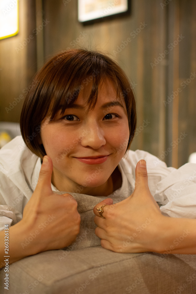 Asian Chinese Girl Having A Good Time At A Coffee Shop In Hangzhou China Wearing A White Shirt