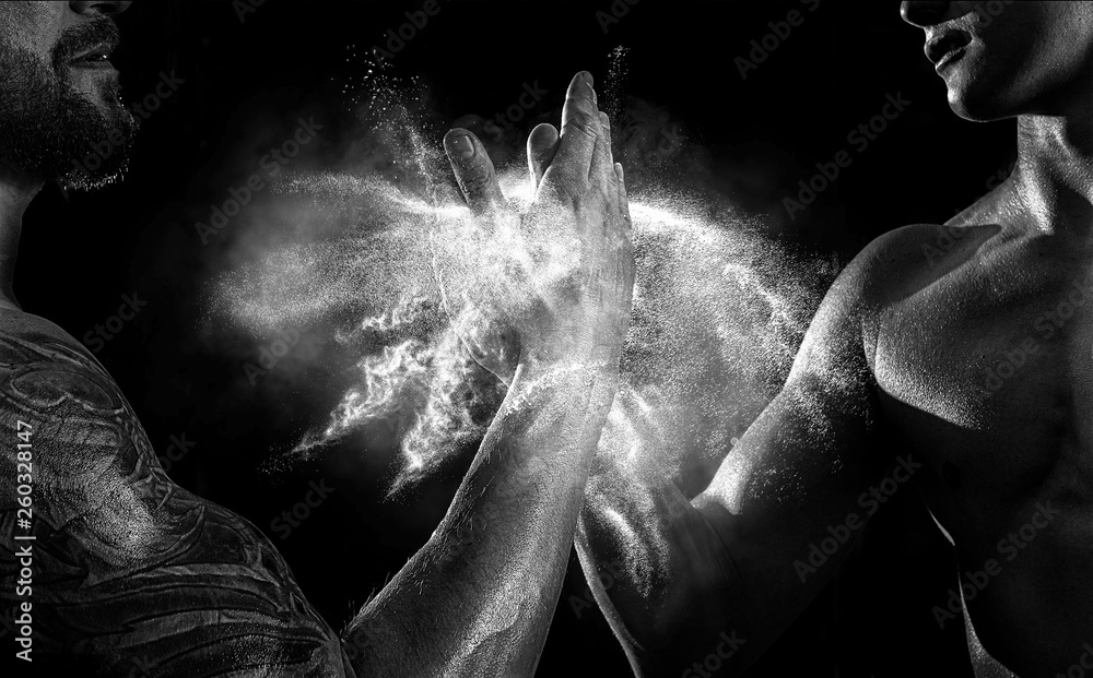 Muscular men clapping hands and preparing for workout at a gym Stock ...