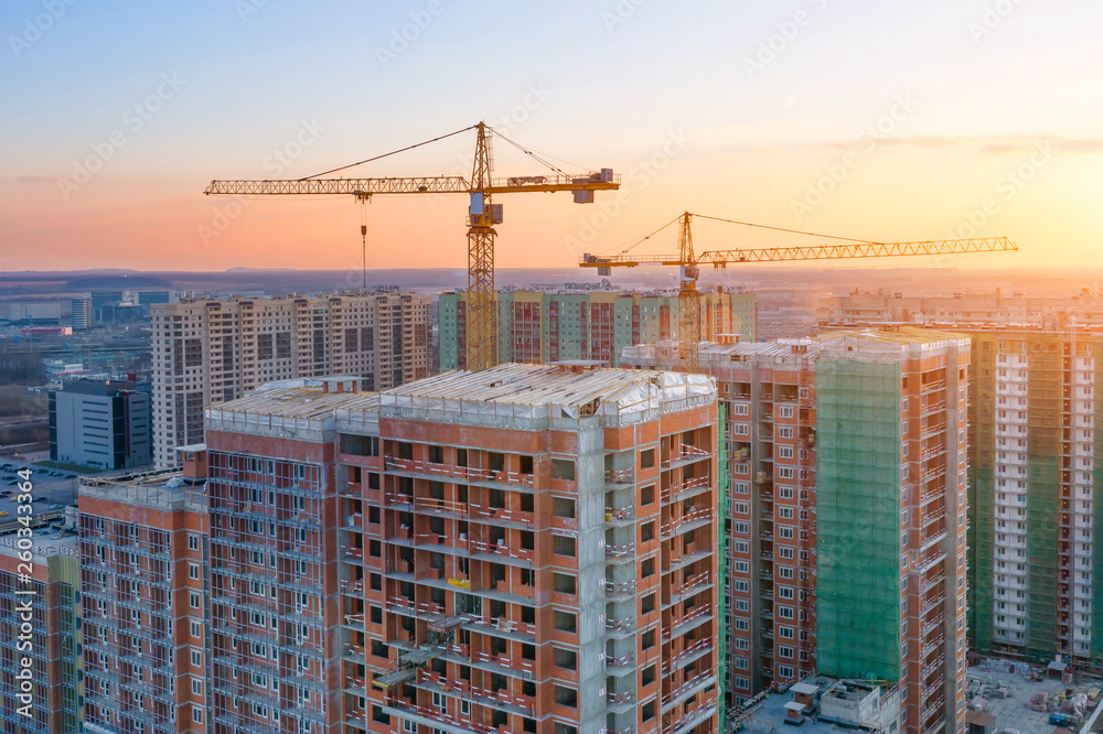 Construction cranes of high-rise residential buildings in the big city ...