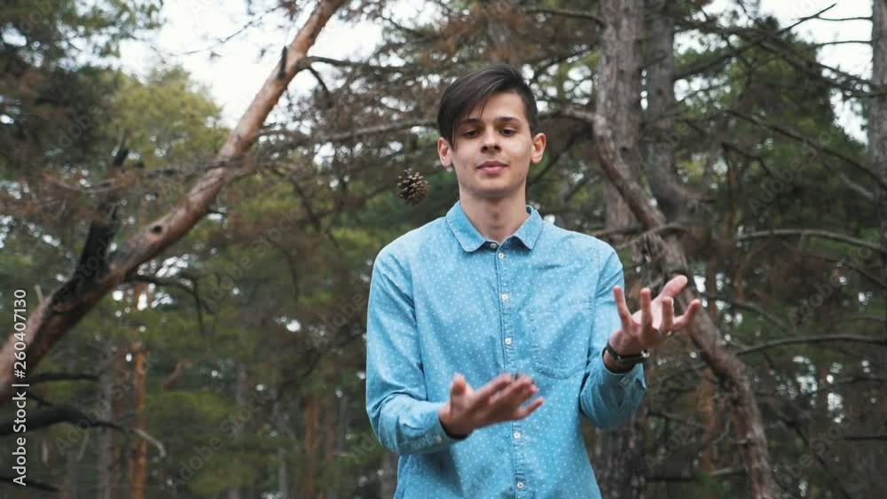 Relaxing sportive man meditating and keeping bent hands before him in ...