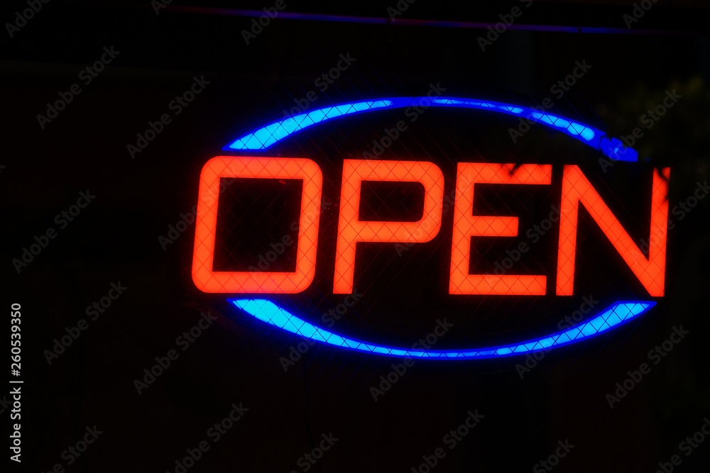 Neon sign of red and blue open letters Stock Photo | Adobe Stock