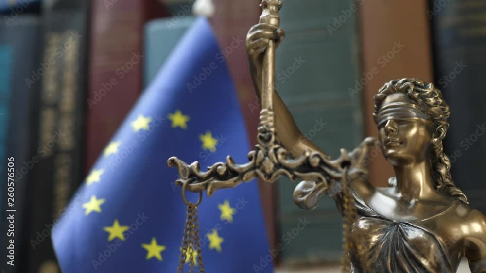 Statue of Lady Justice with Bookshelf with Books and European Union ...