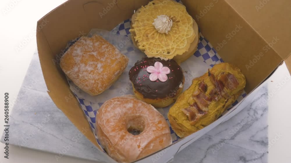Box of assorted gourmet donuts to celebrate National Doughnut Day. The ...