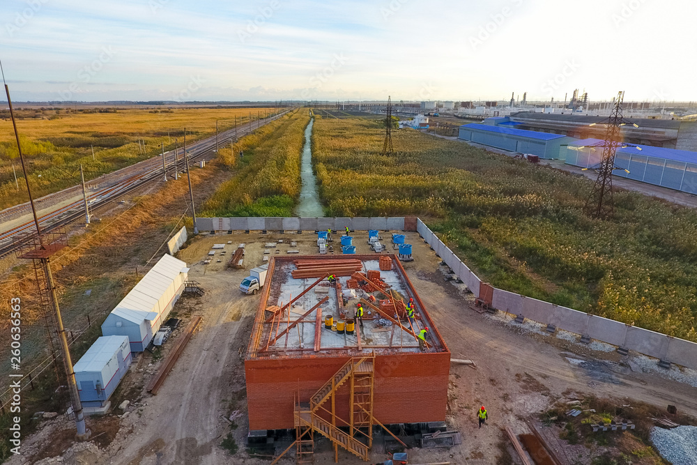 Construction of a brick building. Installation of the roof ...