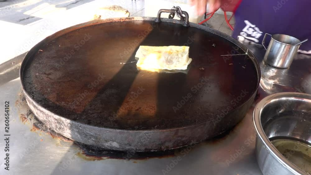 Roti Making, roti thresh flour by roti maker with oil and butter. Asian ...