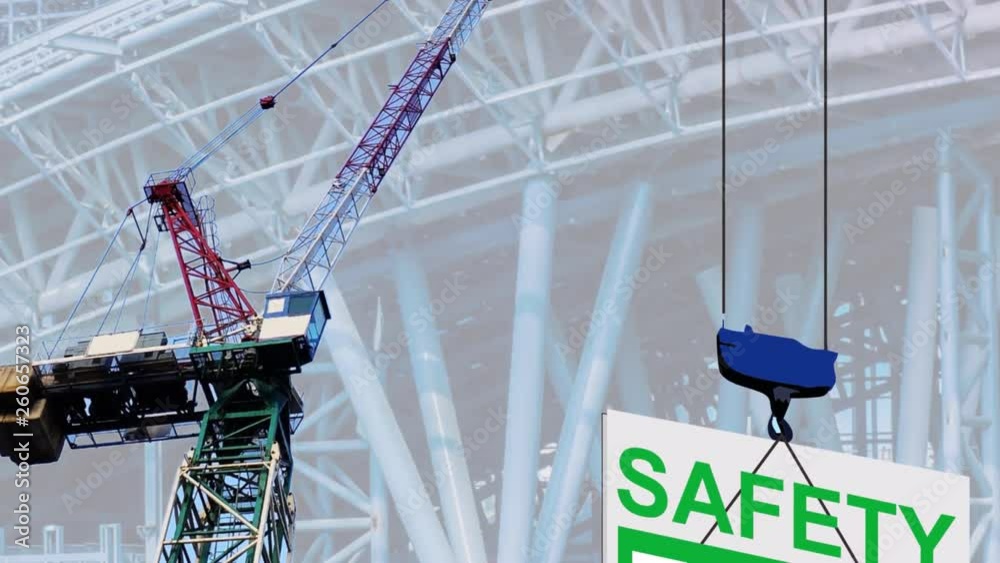 footage vdo. of tower crane lifting a green wording safety first ...