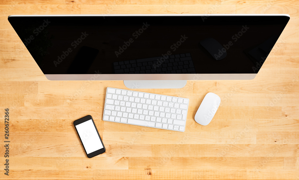 Desktop computer top view. Top view of wooden office desk with large ...