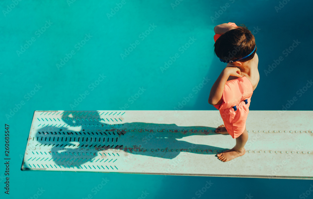 Boy learning diving at pool Stock Photo | Adobe Stock