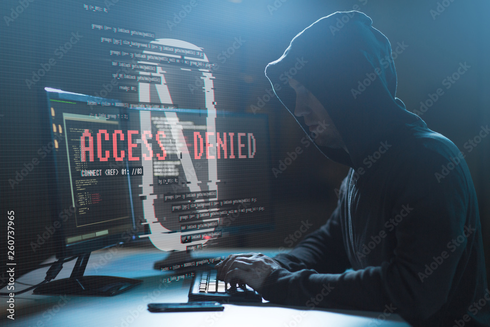 cybercrime, hacking and technology concept - male hacker with access denied message on computer ...