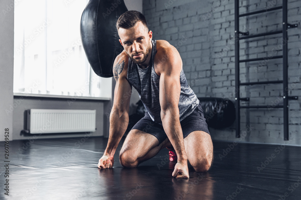 No doubt. The athlete relaxing in the gym after strength exercises for ...