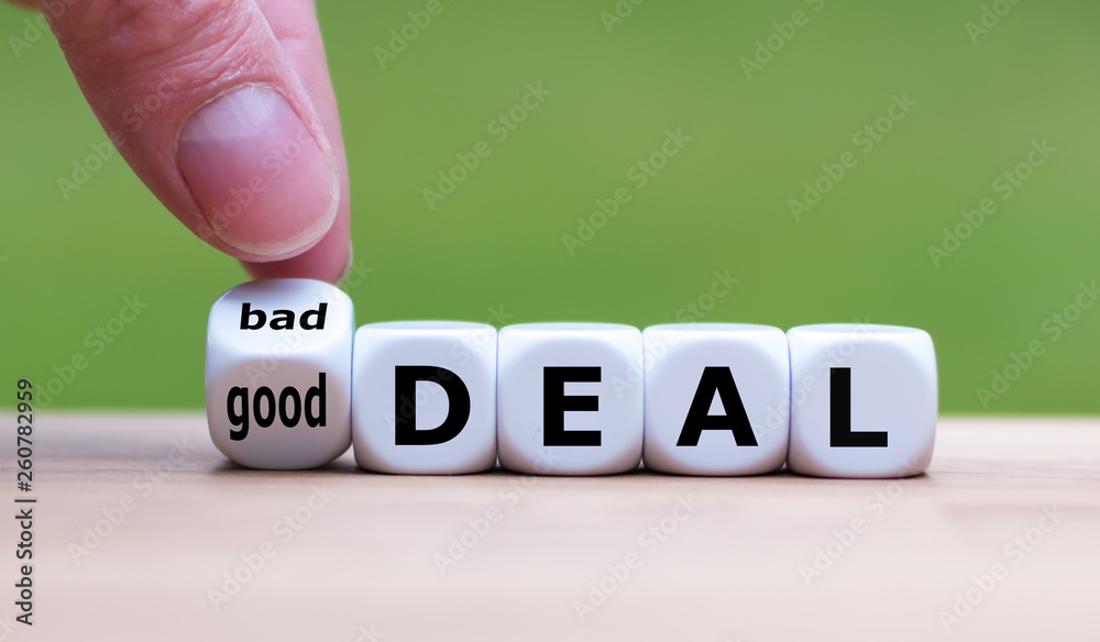 Hand turns a dice and changes the expression "bad deal" to "good deal ...