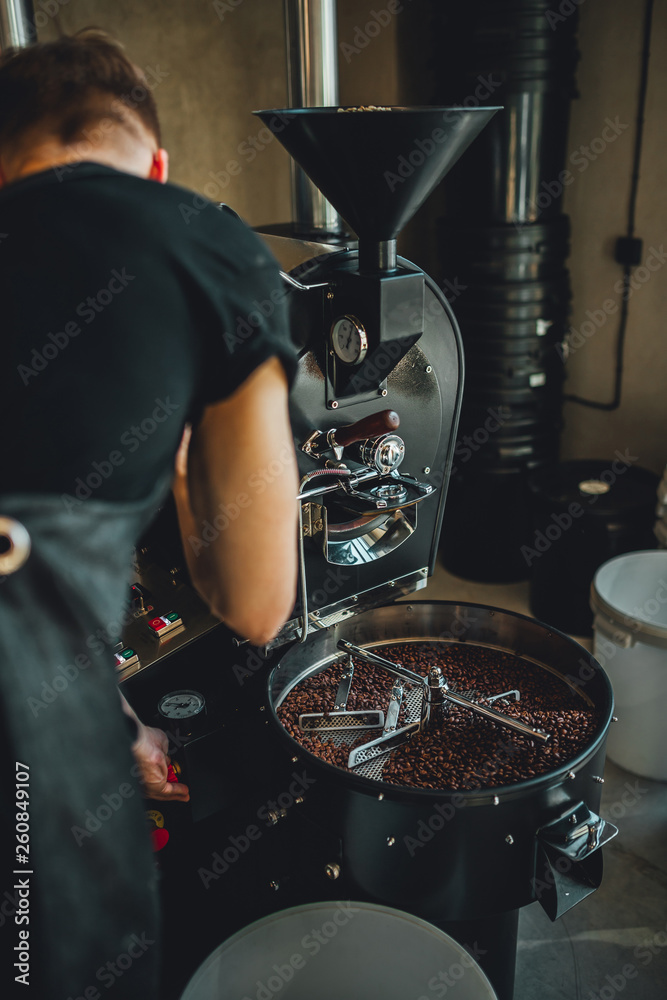 Coffee roasting in small roastery. Coffee roasting machine, Production ...