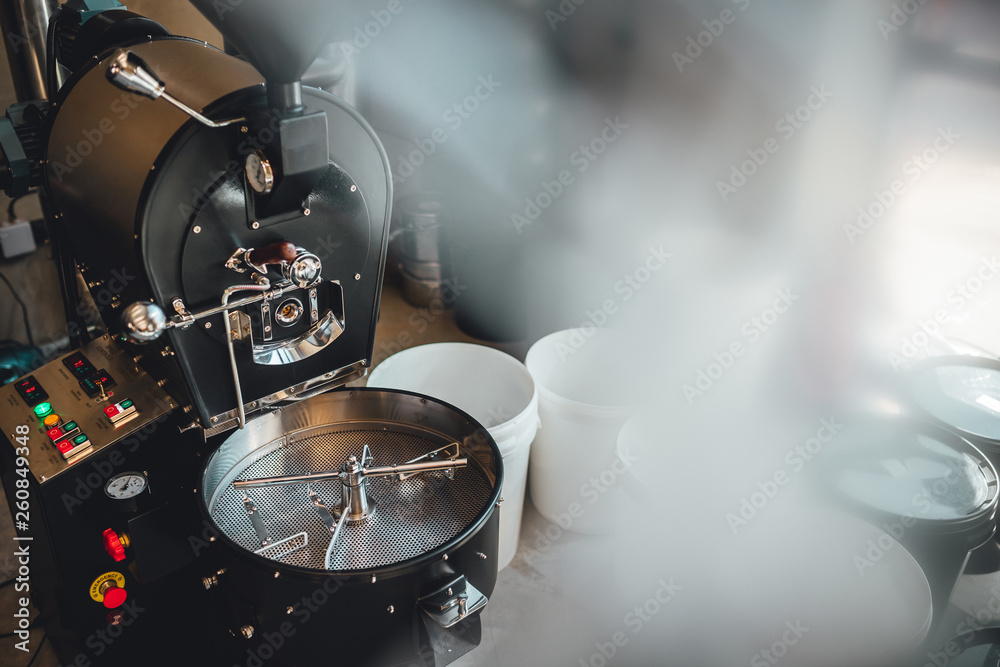 Coffee roasting in small roastery. Coffee roasting machine, Production ...