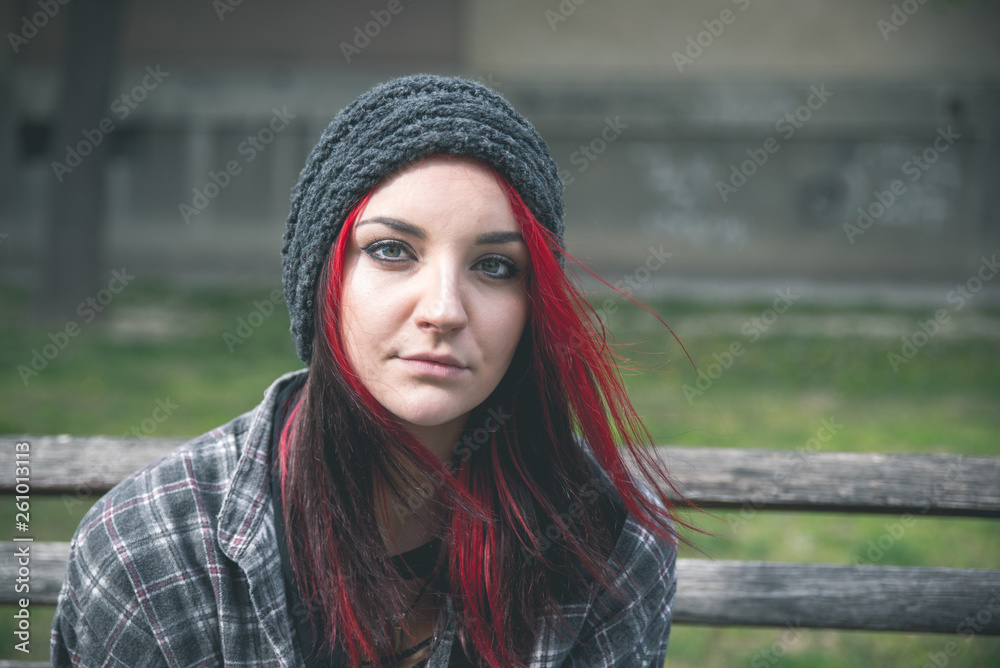 Homeless girl, Young beautiful red hair girl sitting alone outdoors on ...
