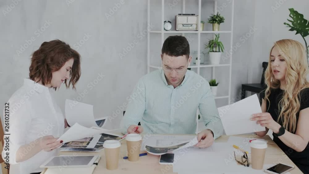 Active Workflow In The Design Studio Colleagues Review And Study Illustrations For A New