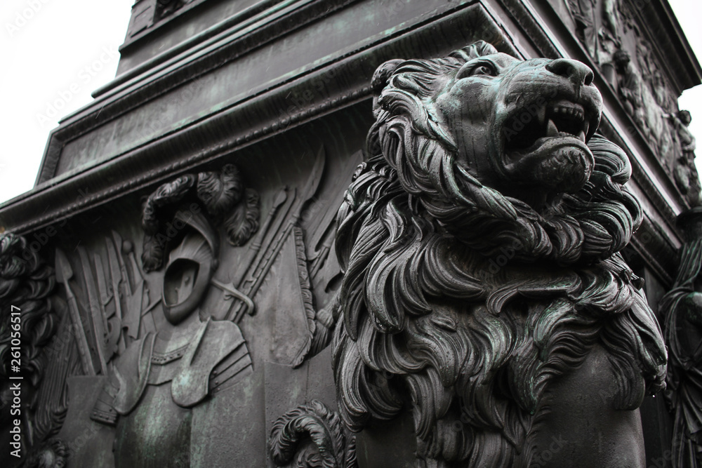 Black glossy metal strong teeth scary hairy Lions statue infront of ...