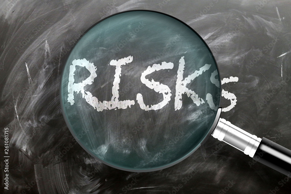 Learn, study and inspect risks - pictured as a magnifying glass ...