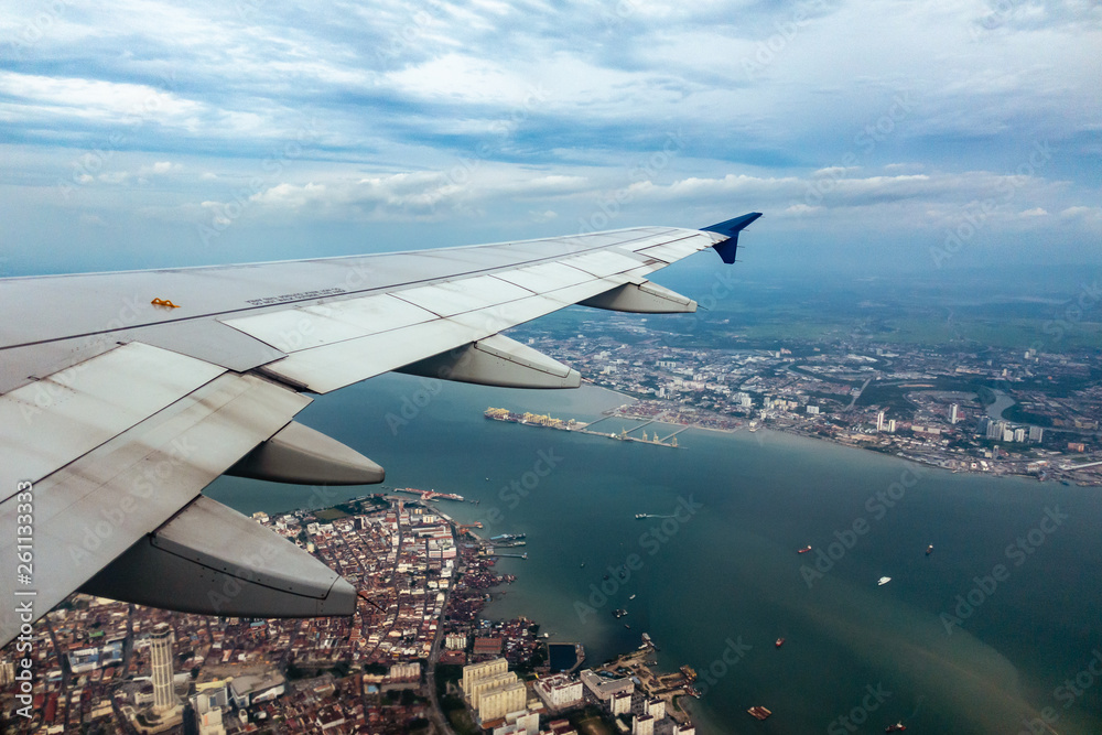 Airplane taking off from Penang airport, viewing from airplane window ...