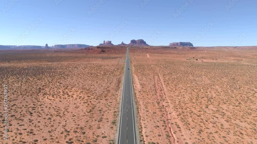 Aerial 4K shooting of the Monument Valley drive. Top view of a car ...