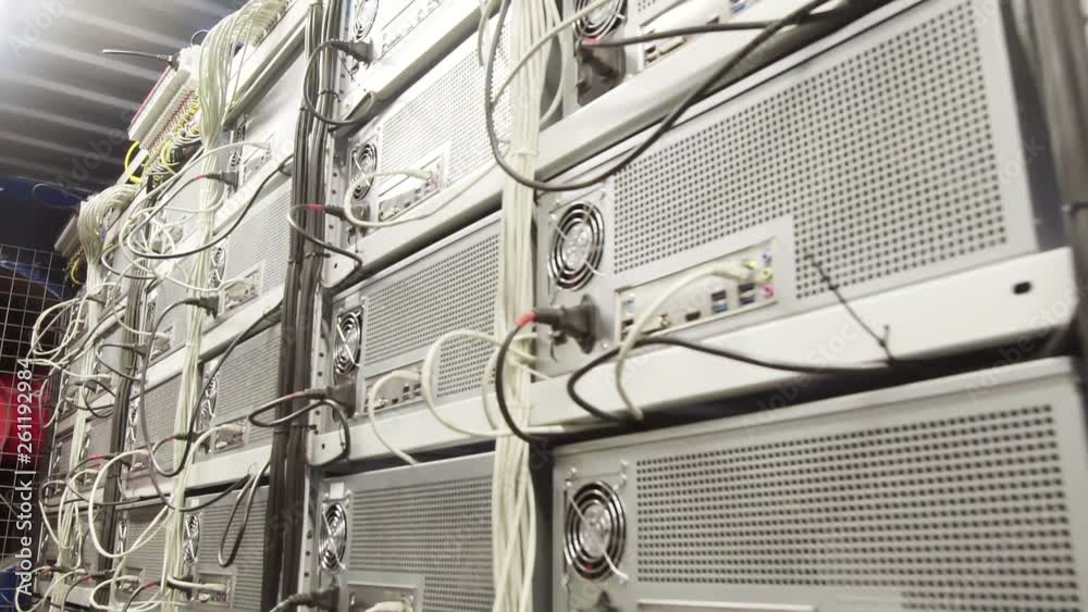 Modern storage room for bitcoins mining farms with tens of rows of ...