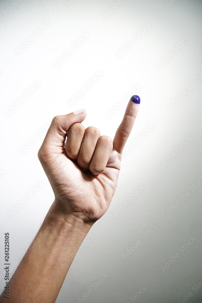 Inked blue finger of a man hand isolated on white background. blue ink ...