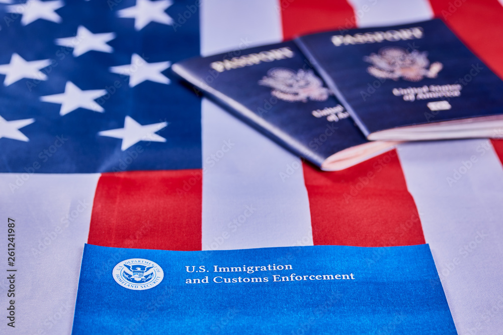 Banner with lettering US Immigration and Customs enforcement next to ...