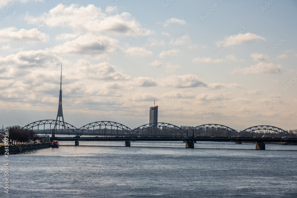 Railway bridge in Riga with television tower behind it Stock Photo ...