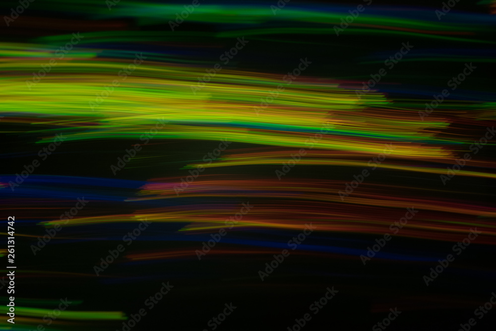 Blurry abstract background with wavy multicolor lines. Neon lights in ...