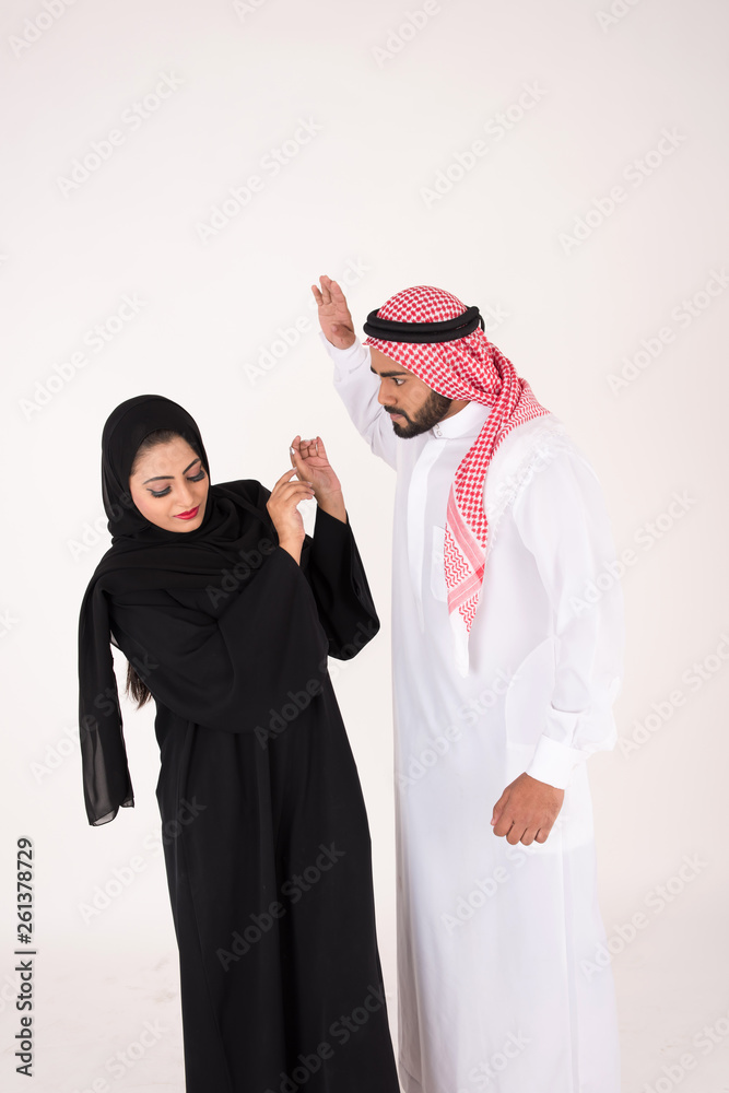 Arab Couple in traditional dress fighting on white background Stock ...