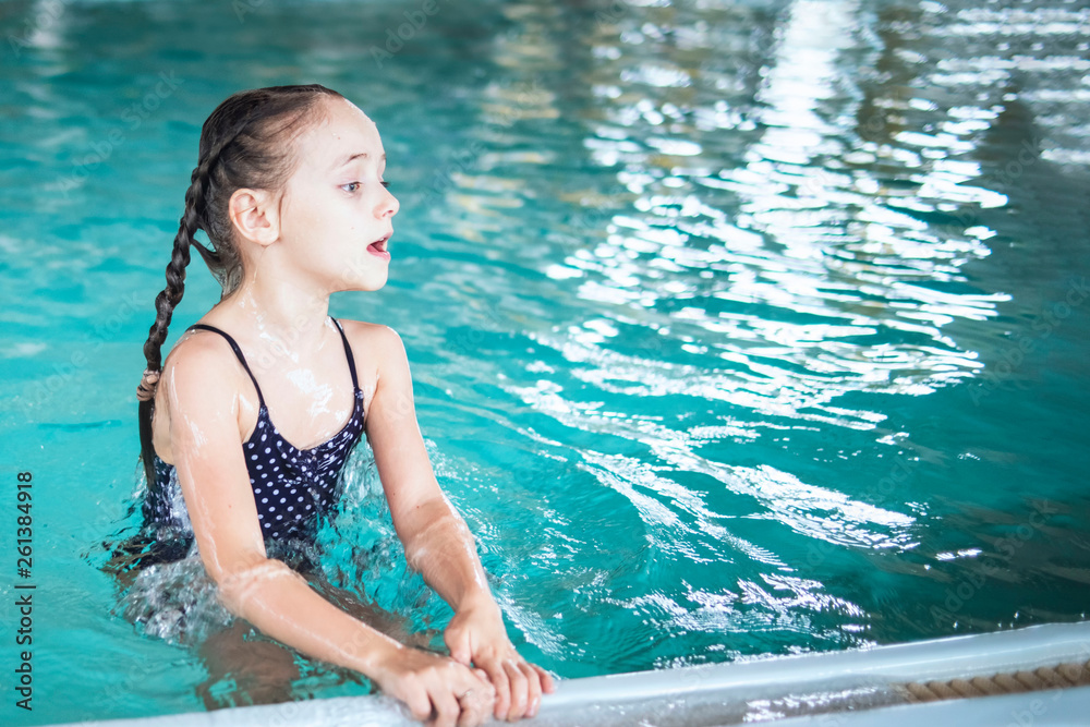 Girl swim in the pool. Happy girl play in the pool.Beautiful girl swim ...