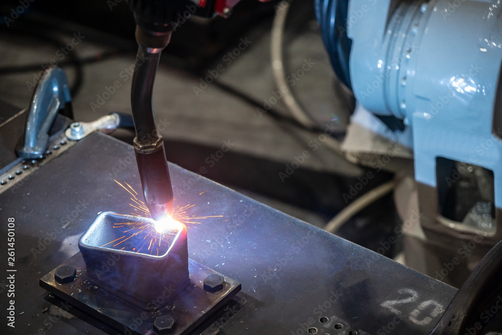 The robotic arm additive welding the sample parts. The hi-technology ...