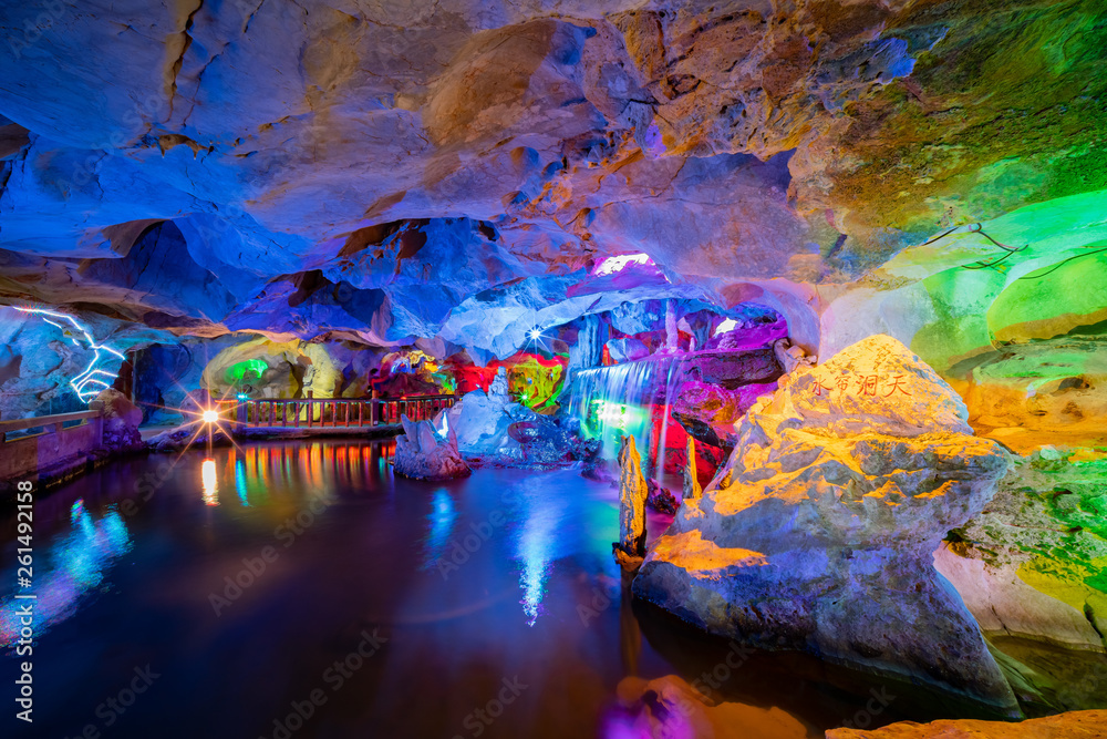 The beautiful Seven Star cave with colorful lights and reflection at ...
