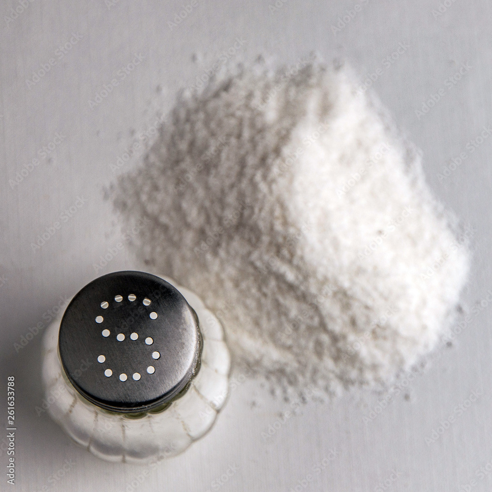 mineral diet: saltcellar with the letter "S" next to a pile of sea salt ...
